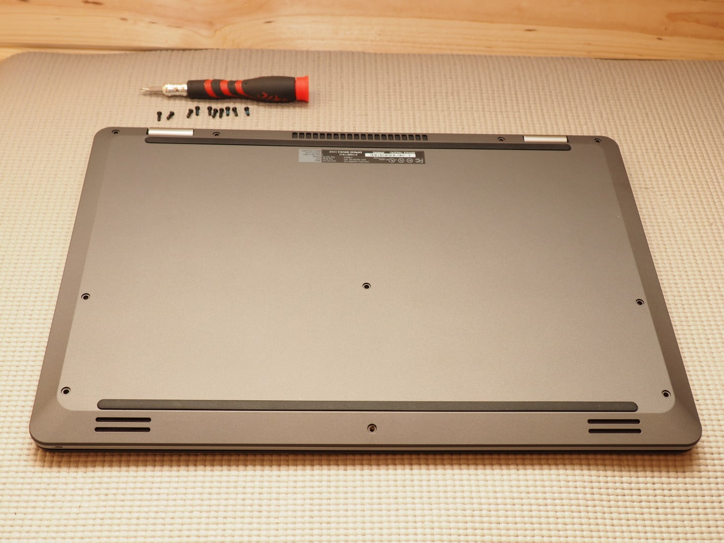 Screws removed from laptop bottom panel | J.D. Hodges